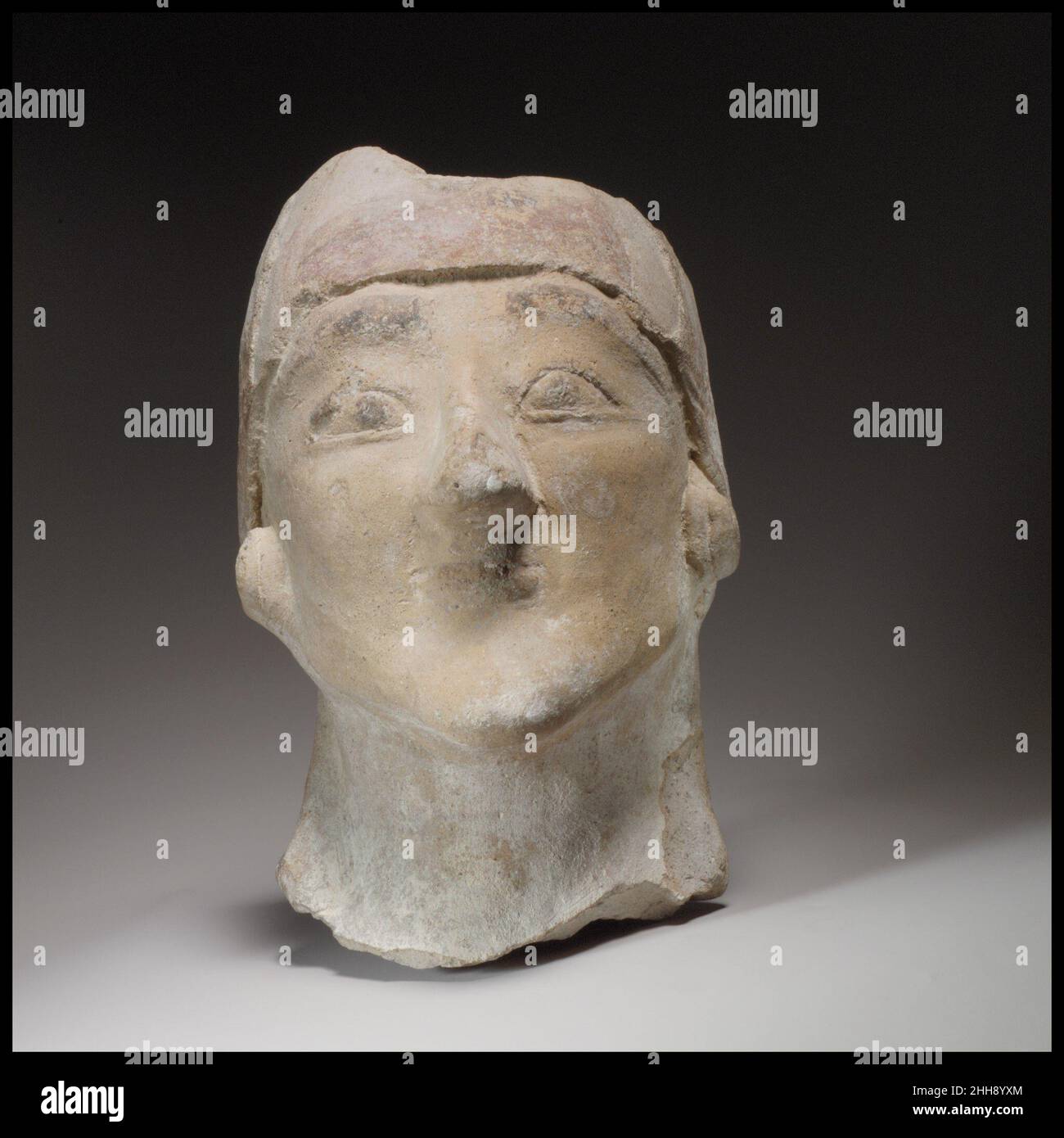 Beardless male head wearing a helmet ca. 600–480 B.C. Cypriot This mold ...