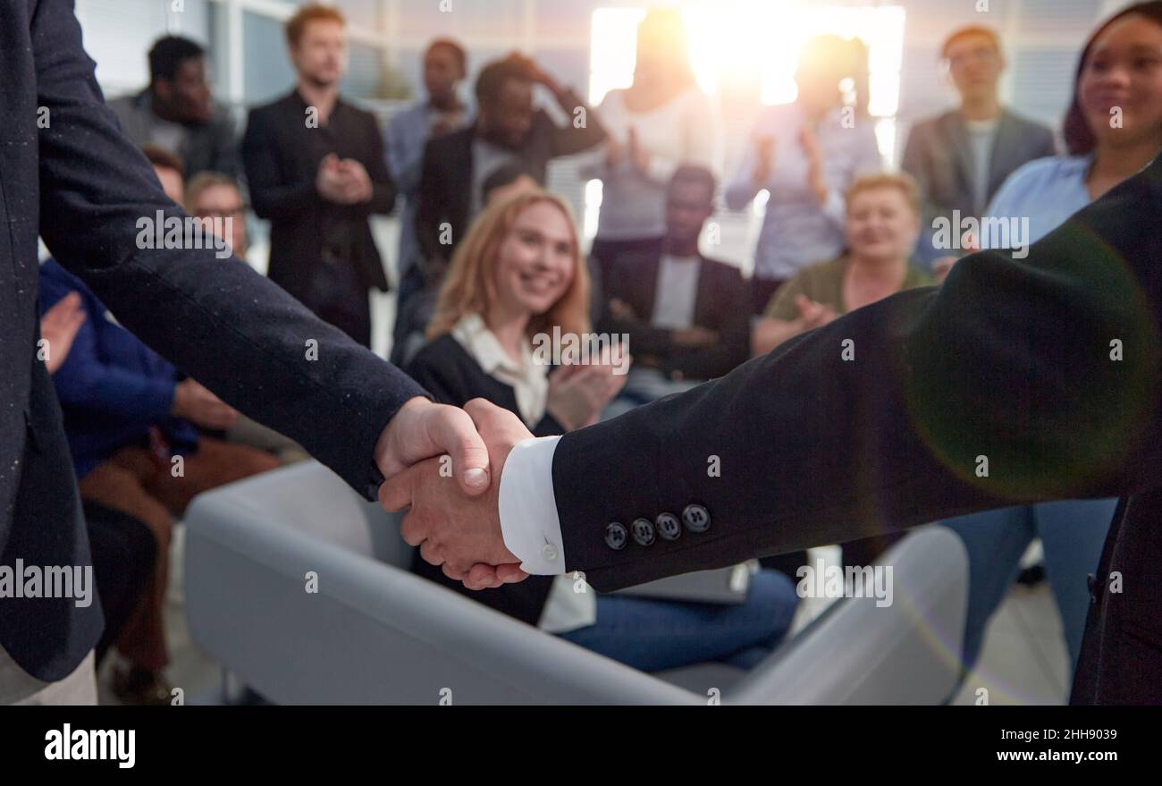 close up. handshake of business people in the meeting room. concept of ...
