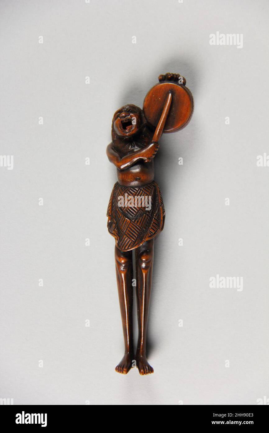 Netsuke of Ashinaga Beating a Drum 19th century Japan. Netsuke of ...