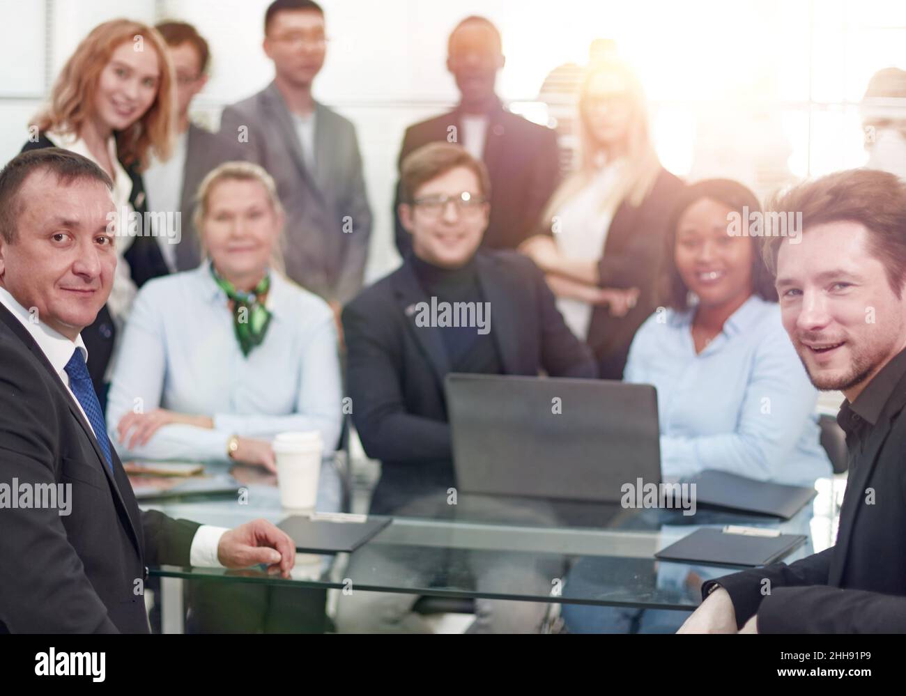Business team working on desktop computer in workstation looking at ...