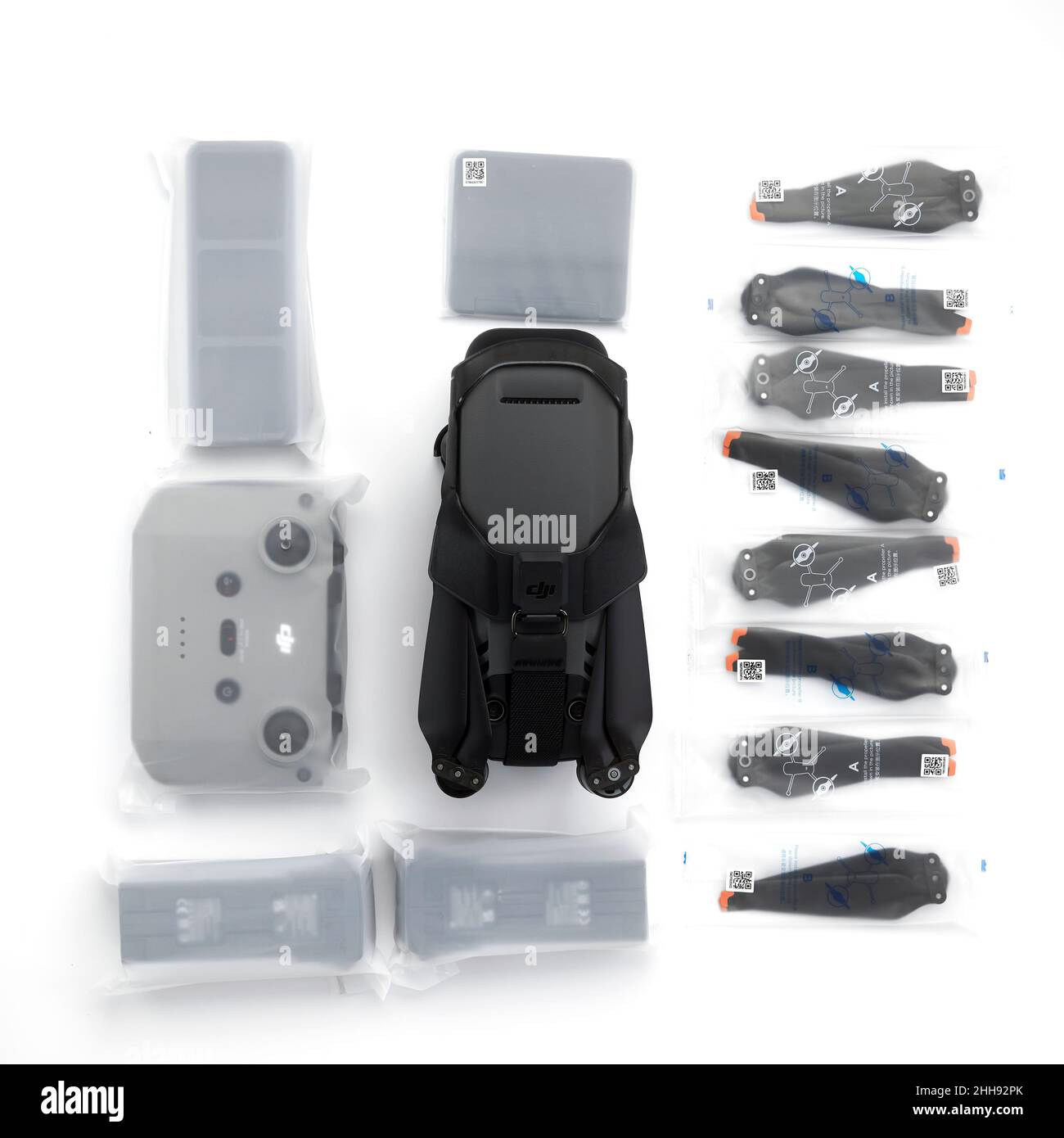 New DJI Mavic 3 drone on a white background when unpacking. Parts of ...