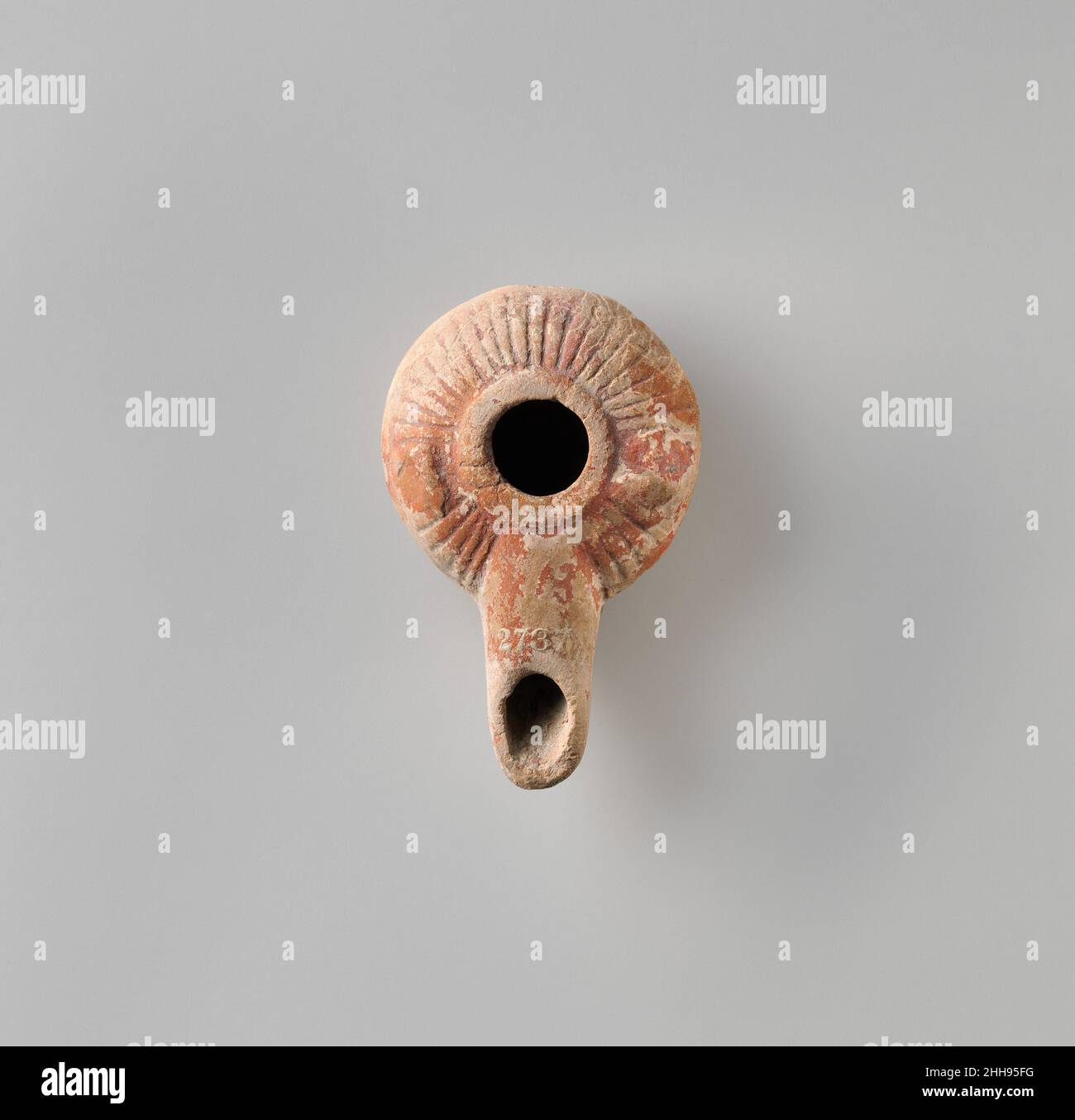 Terracotta oil lamp Greek Mold-made. Carinated body. Large central ...