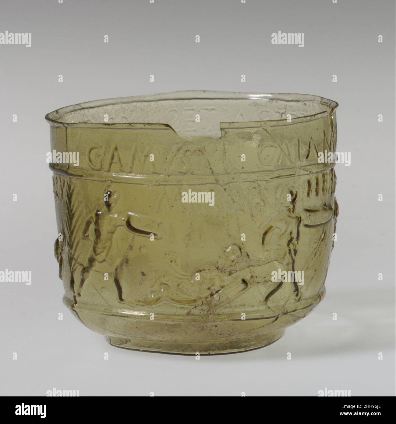 Glass gladiator cup ca. A.D. 50–80 Roman Translucent greenish yellow ...