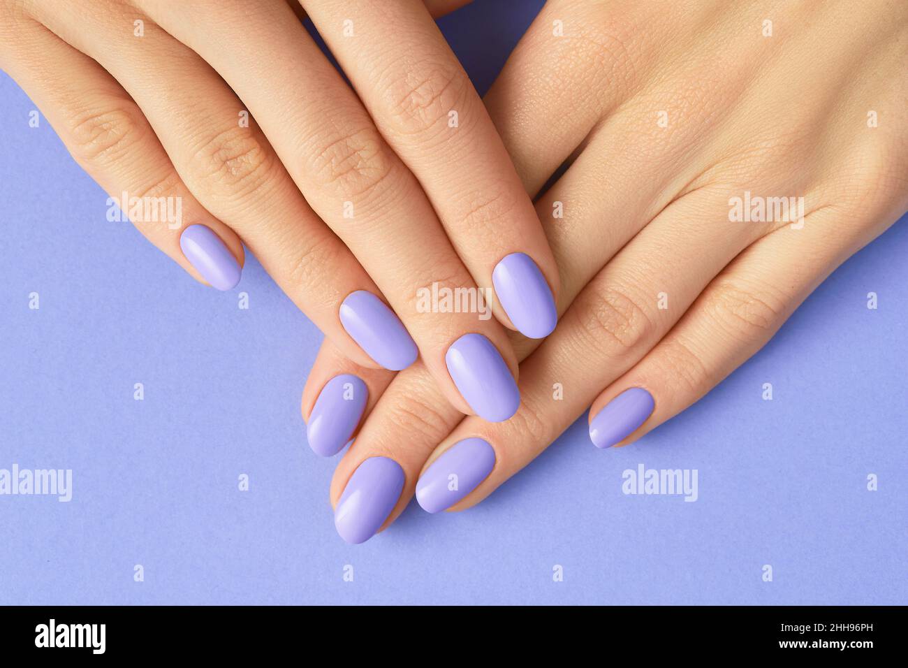 Womans hands with fashionable very peri manicure. Spring summer nail ...