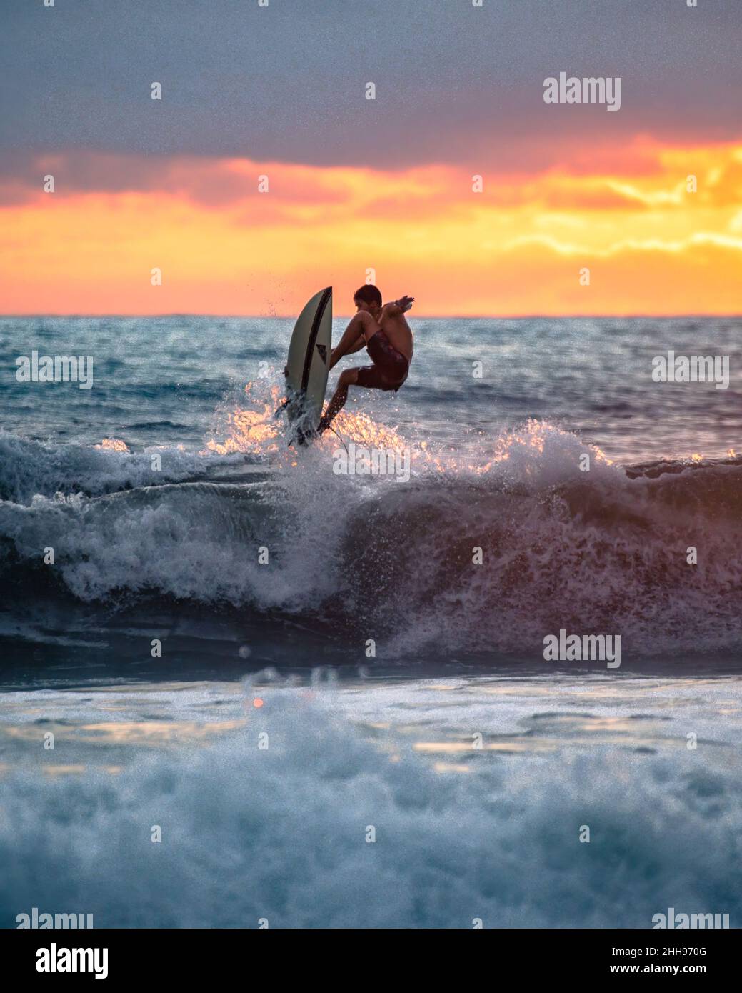 Surfer Jumping Higher in Costa Rica Stock Photo - Alamy
