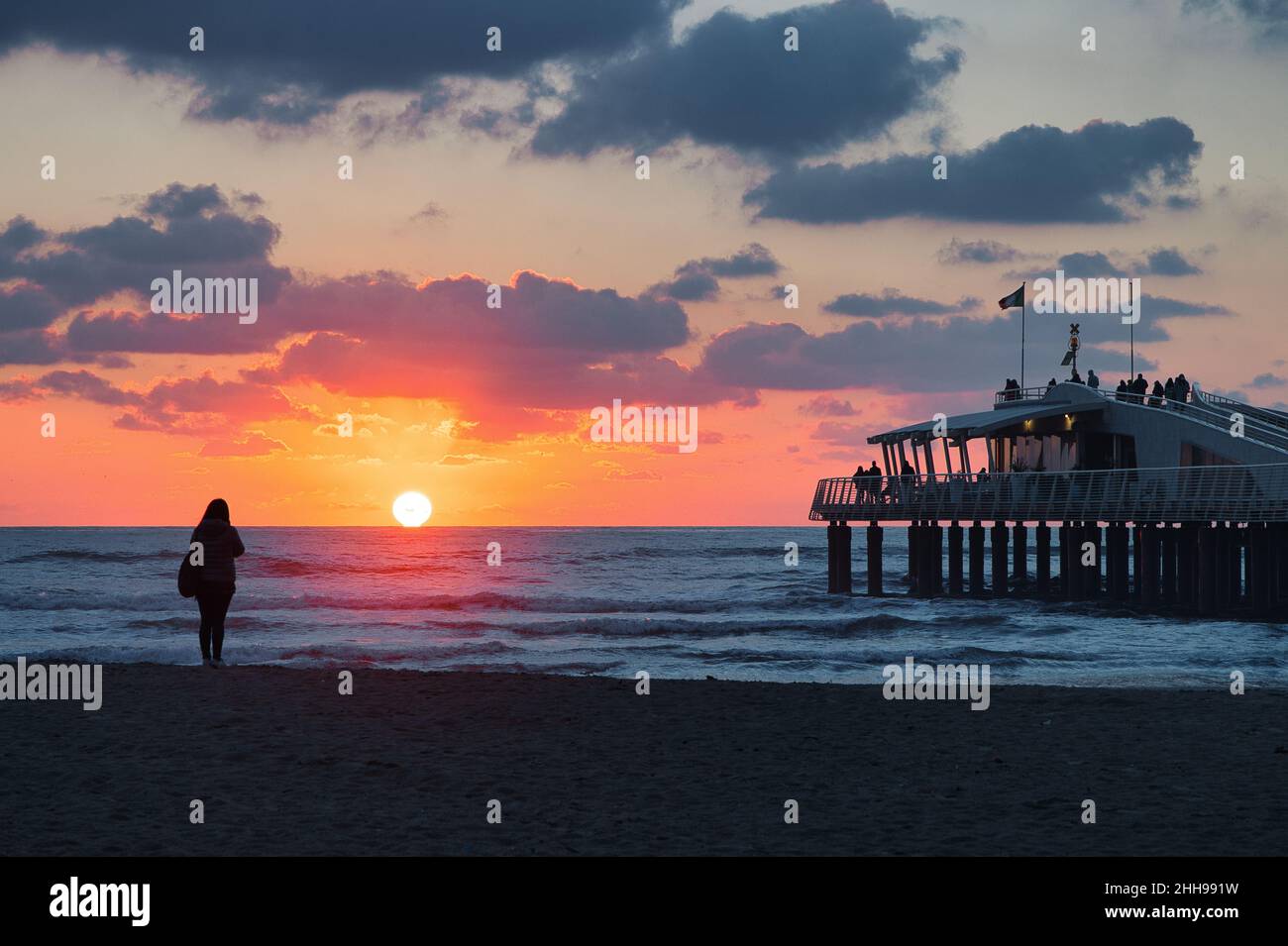 Pier at sunset Stock Photo - Alamy