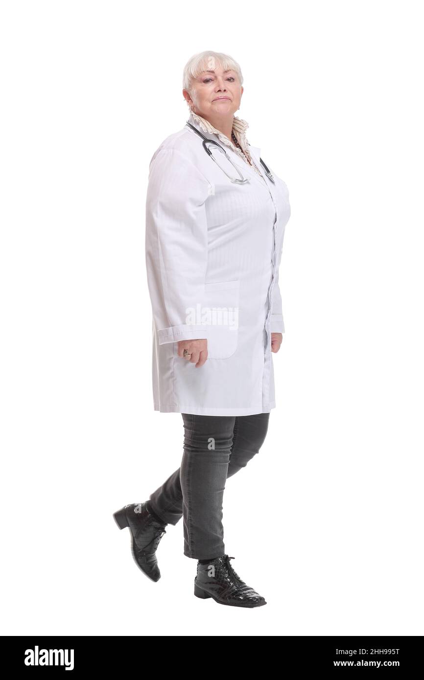 Front view of female doctor walking towards the camera smiling isolated ...