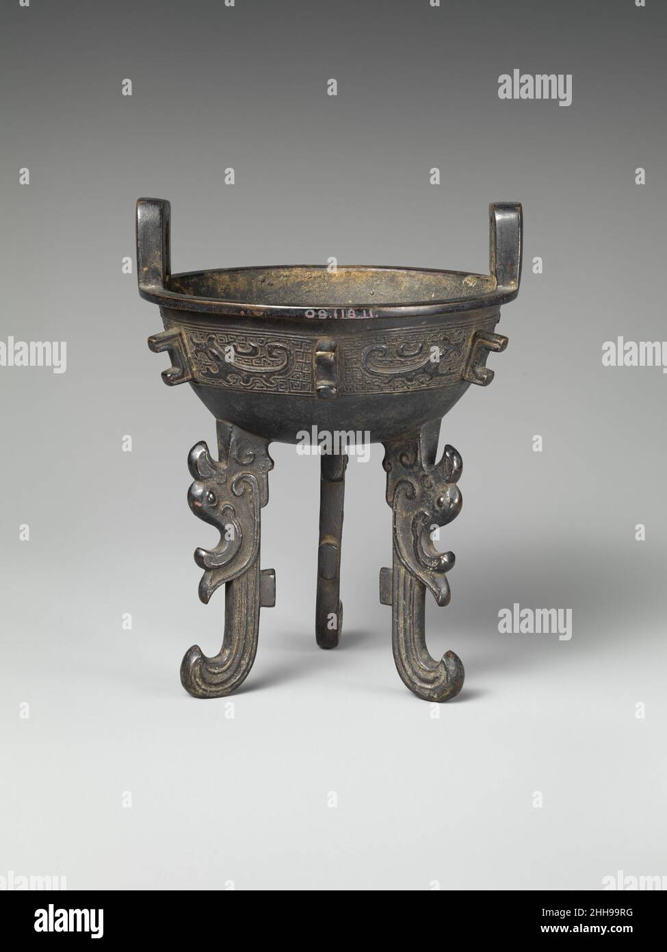 Three legged bronze vessel hi-res stock photography and images - Alamy