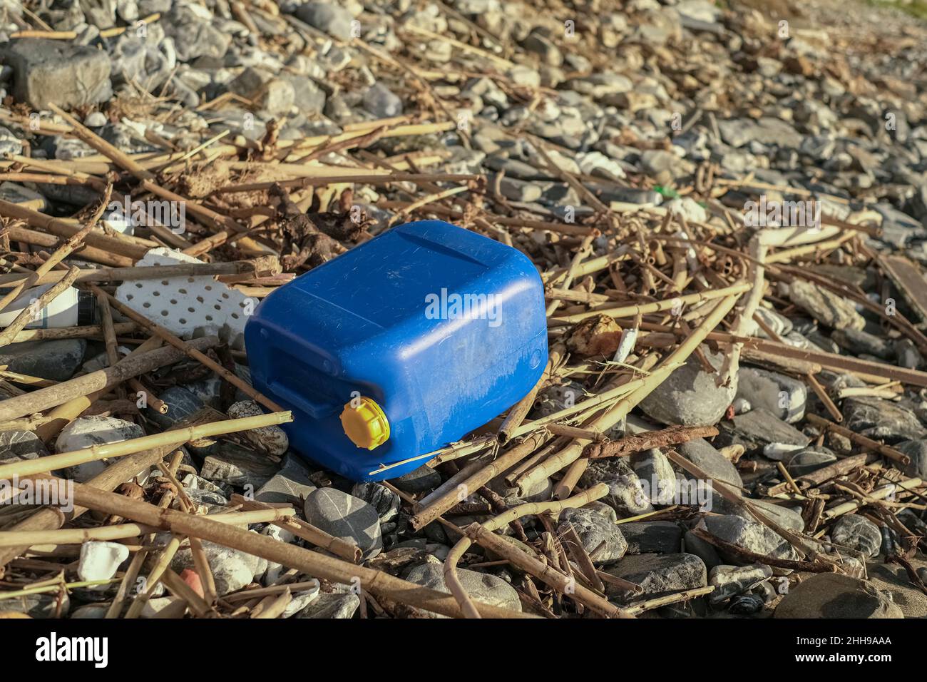 Plastic fuel tank discarded on contaminated sea coast ecosystem ...