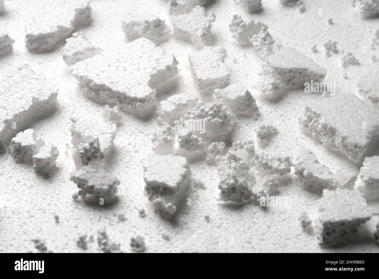 Broken pieces of white styrofoam on the sheet of white styrofoam Stock ...