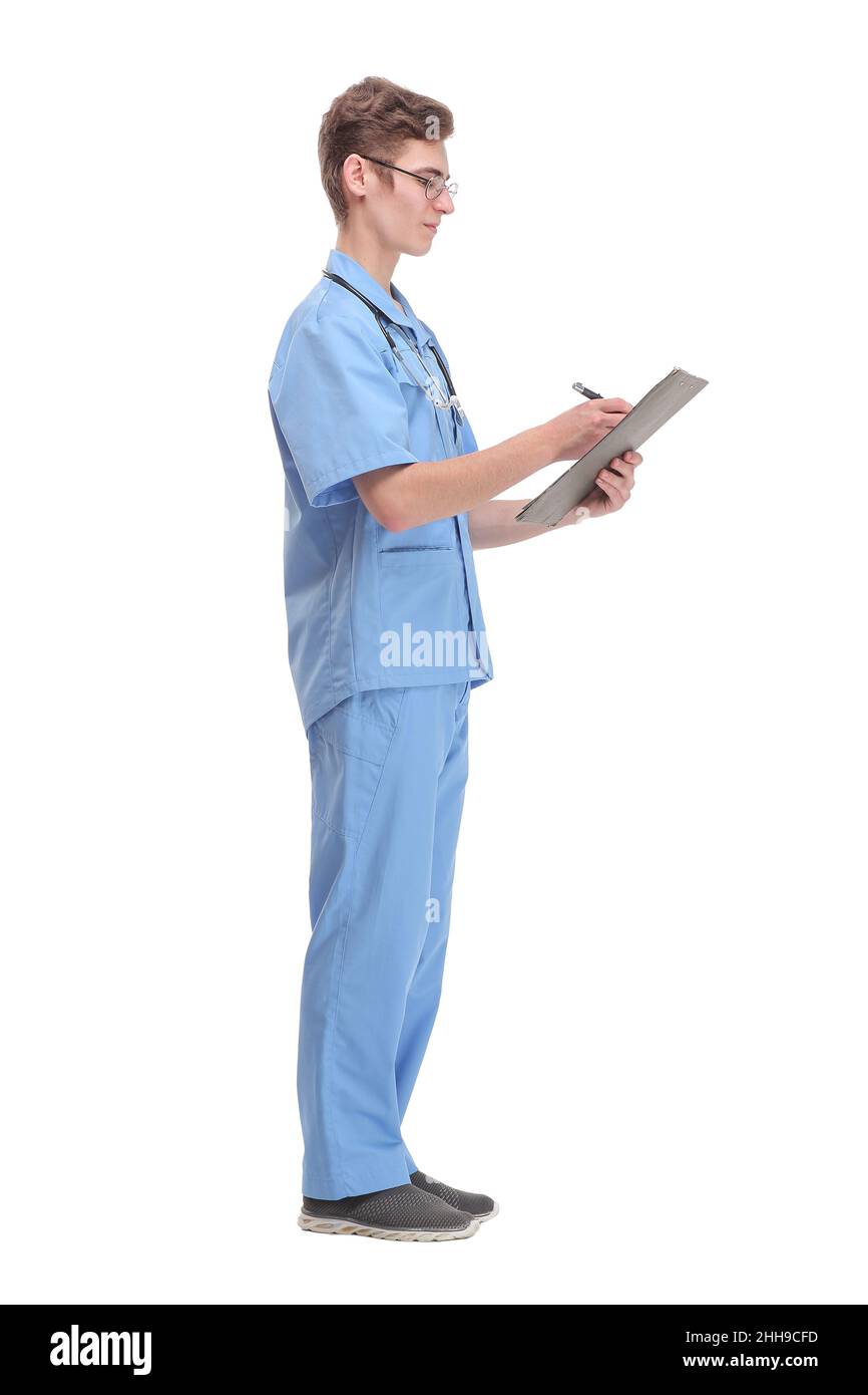Side view of concentrated male doctor writing reports Stock Photo - Alamy