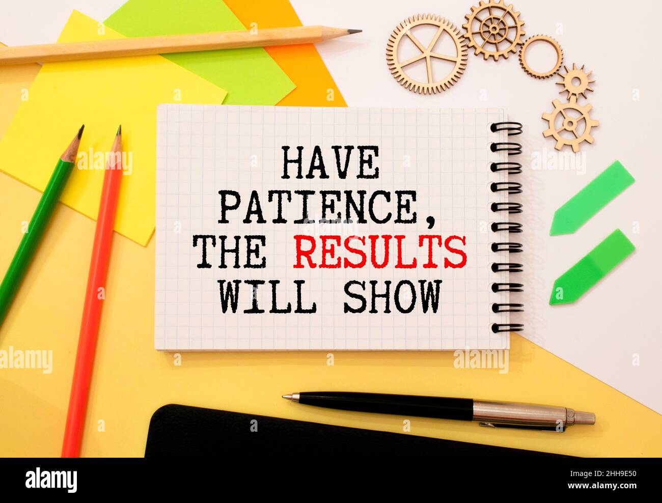 Closeup on businessman holding a card with text HAVE PATIENCE, THE ...