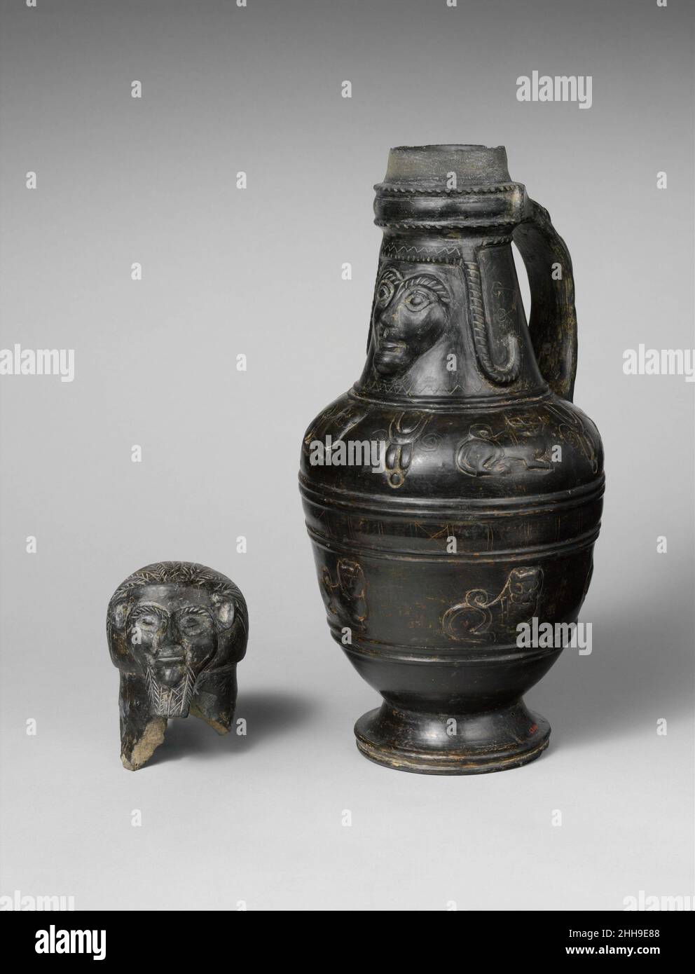 Terracotta jug and lid ca. 550 B.C. Etruscan Such elaborate jugs, often ...