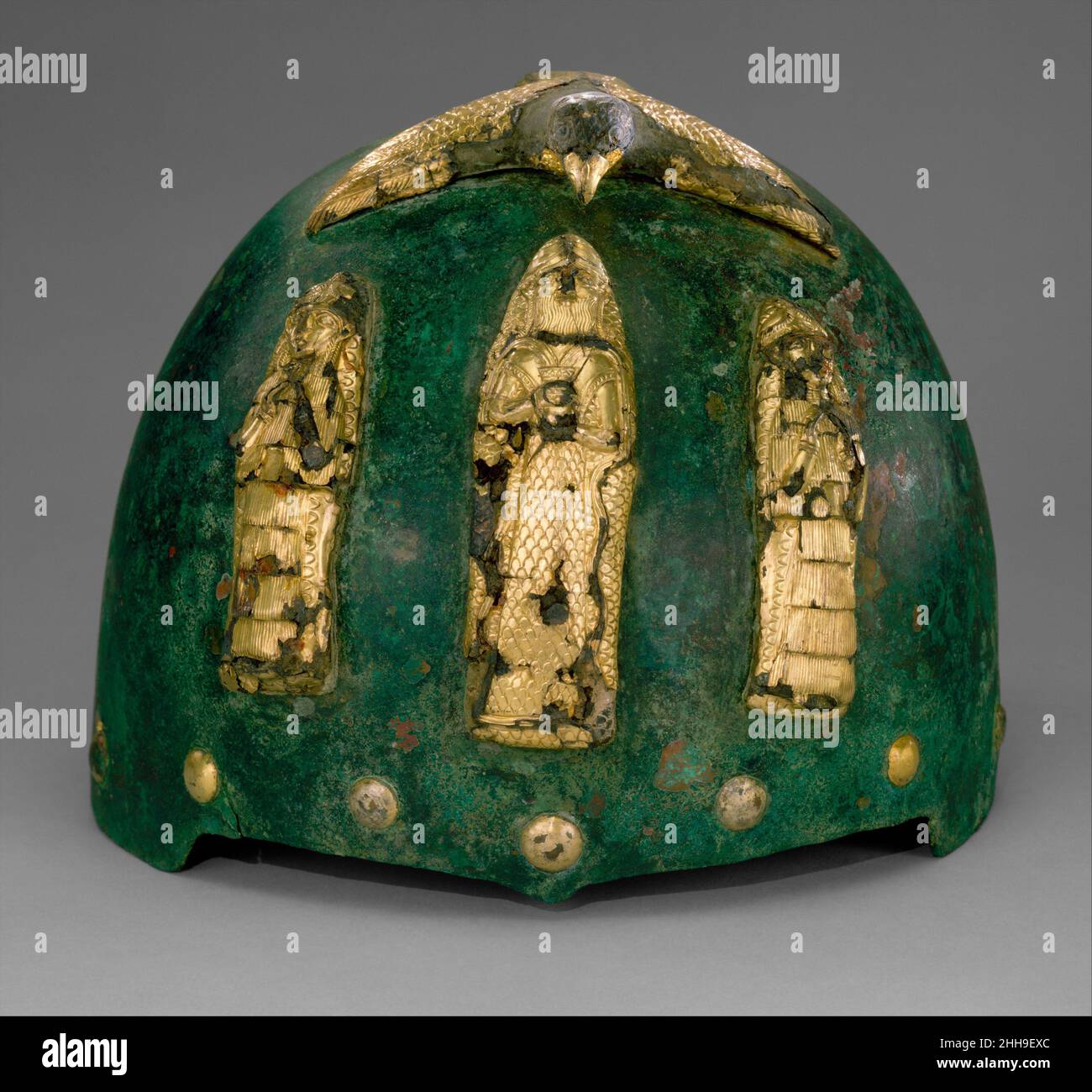 Helmet with divine figures beneath a bird with outstretched wings ca ...
