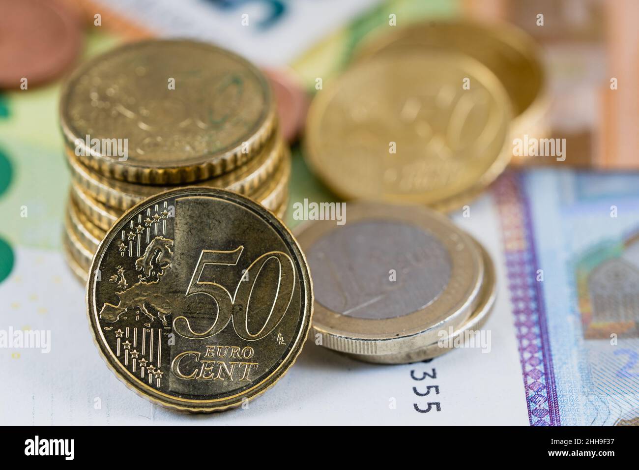 Close-up of euro coins on euro bills of different values Stock Photo ...