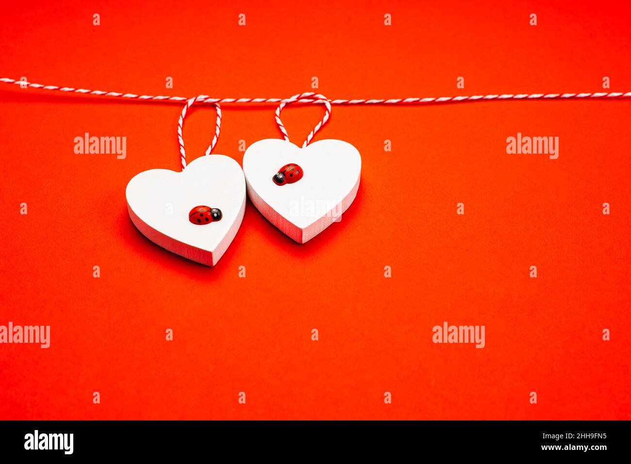 Greeting card. Love concept.Two white hearts on a red background ...