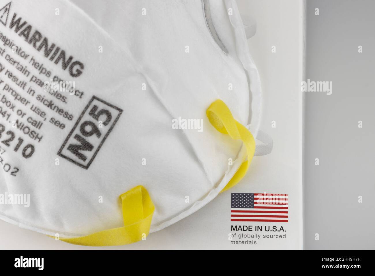 an N95 face mask on a box with an Made in USA of globally sourced ...
