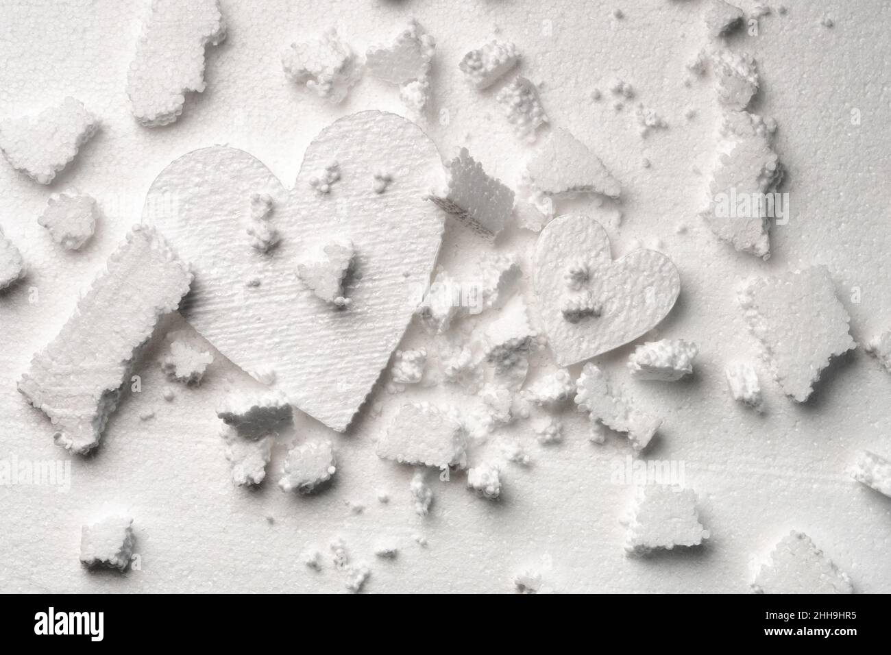Two styrofoam hearts under the broken styrofoam fragments Stock Photo ...