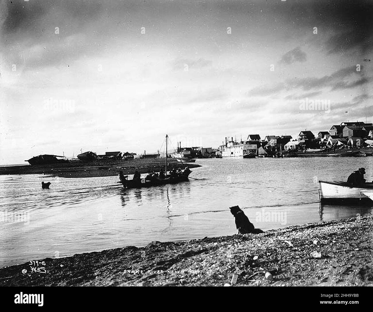 Small boat navigating the Snake River, Nome, Alaska, September 29, 1900 ...
