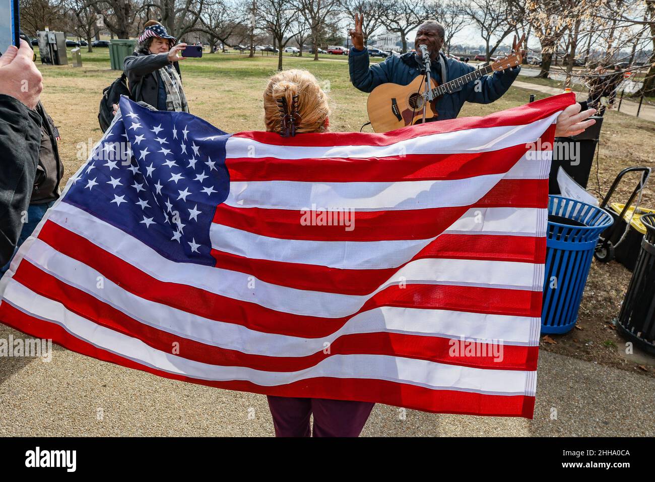 A marchers dances dropped in an American Flag during a march and ...