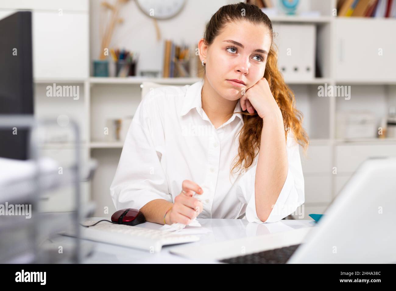 Portrait of distressed female office worker Stock Photo - Alamy