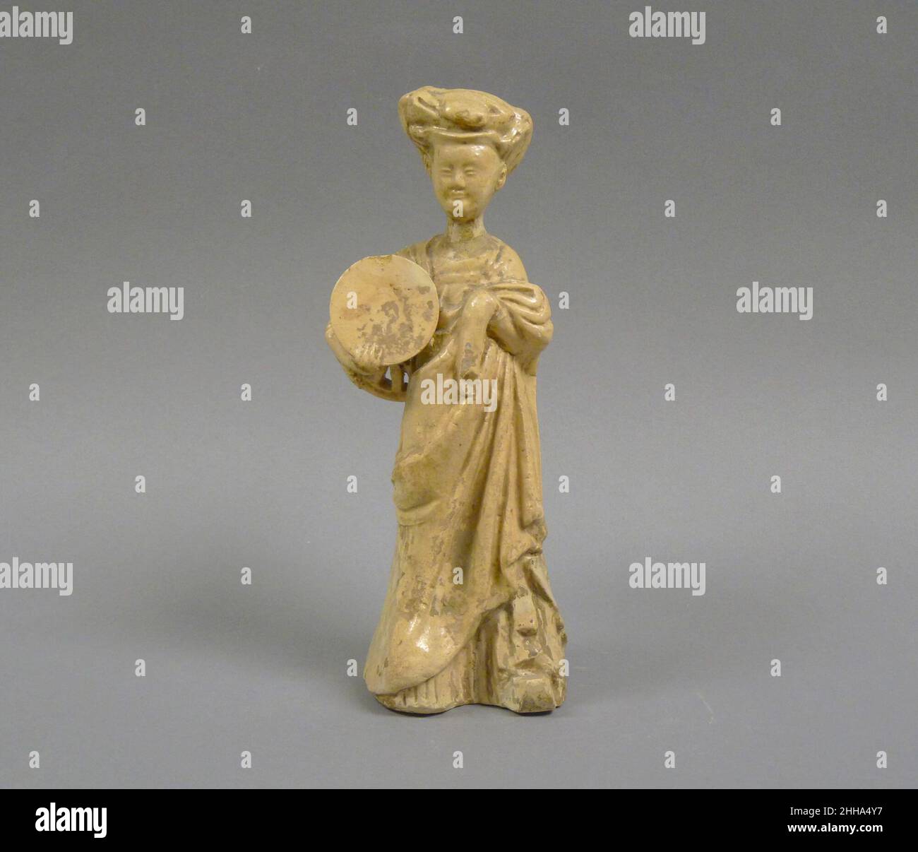 Female attendant carrying a stool late 6th–early 7th century China ...