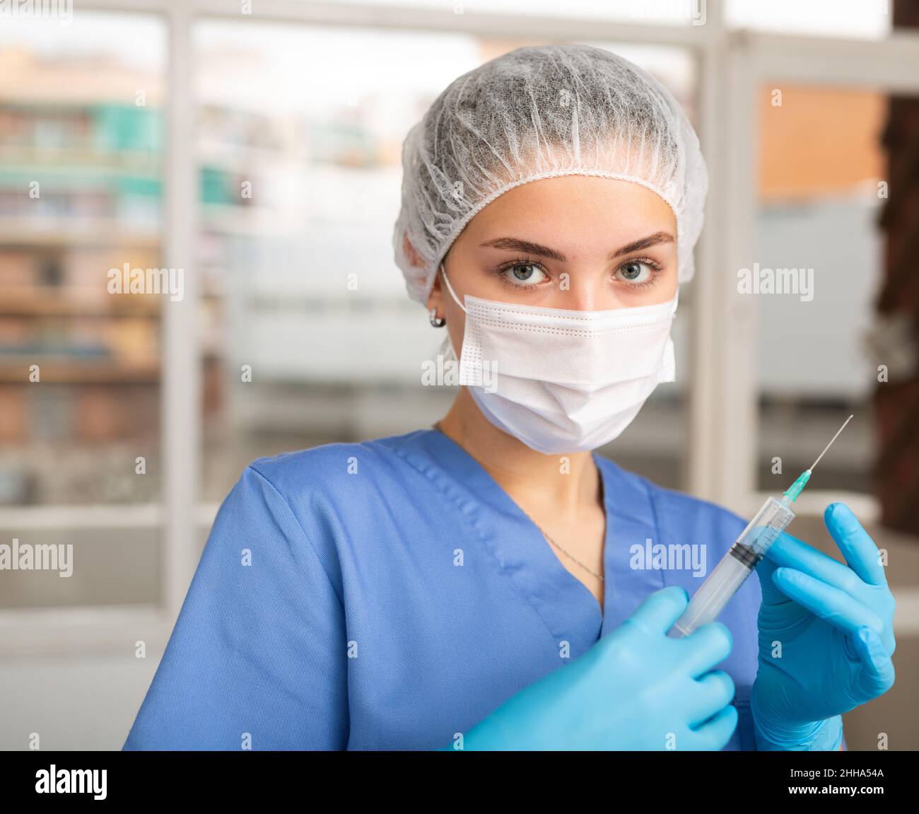 Female nurse or doctor wearing in face mask and medical uniform Stock ...