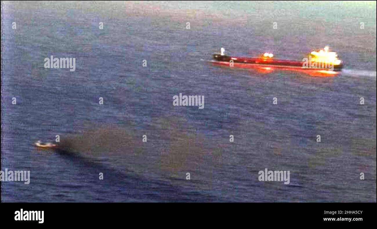 Smoke rises from the Taiwanese fishing vessel Shin Maan Chun, lower ...