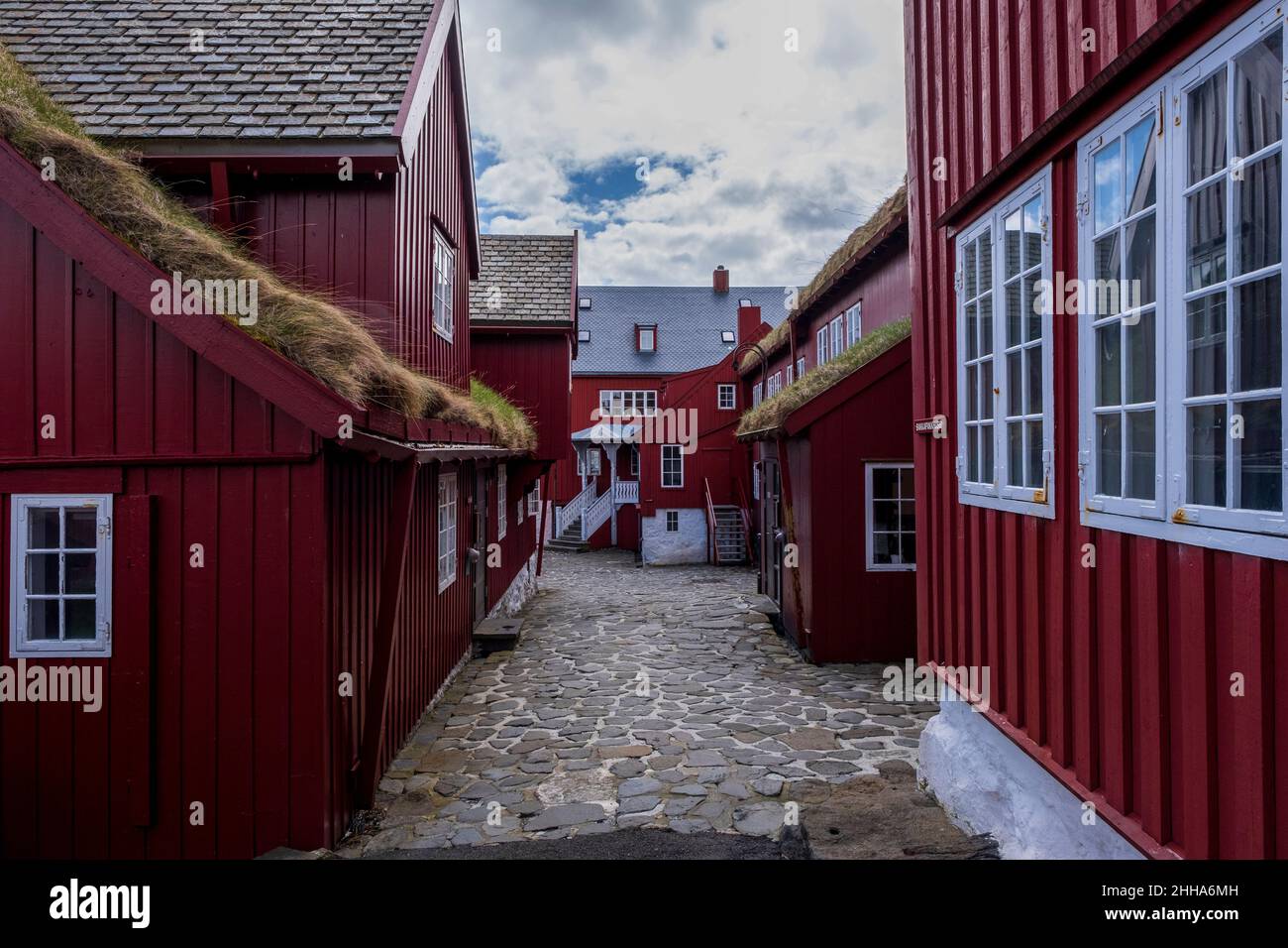 This village with its red houses, white windows, grass rooves and ...