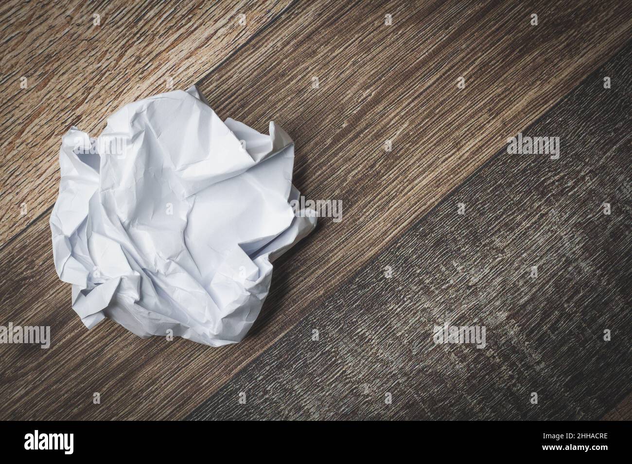 Crumpled and torn paper on the table. Torn piece of notebook. Paper ...