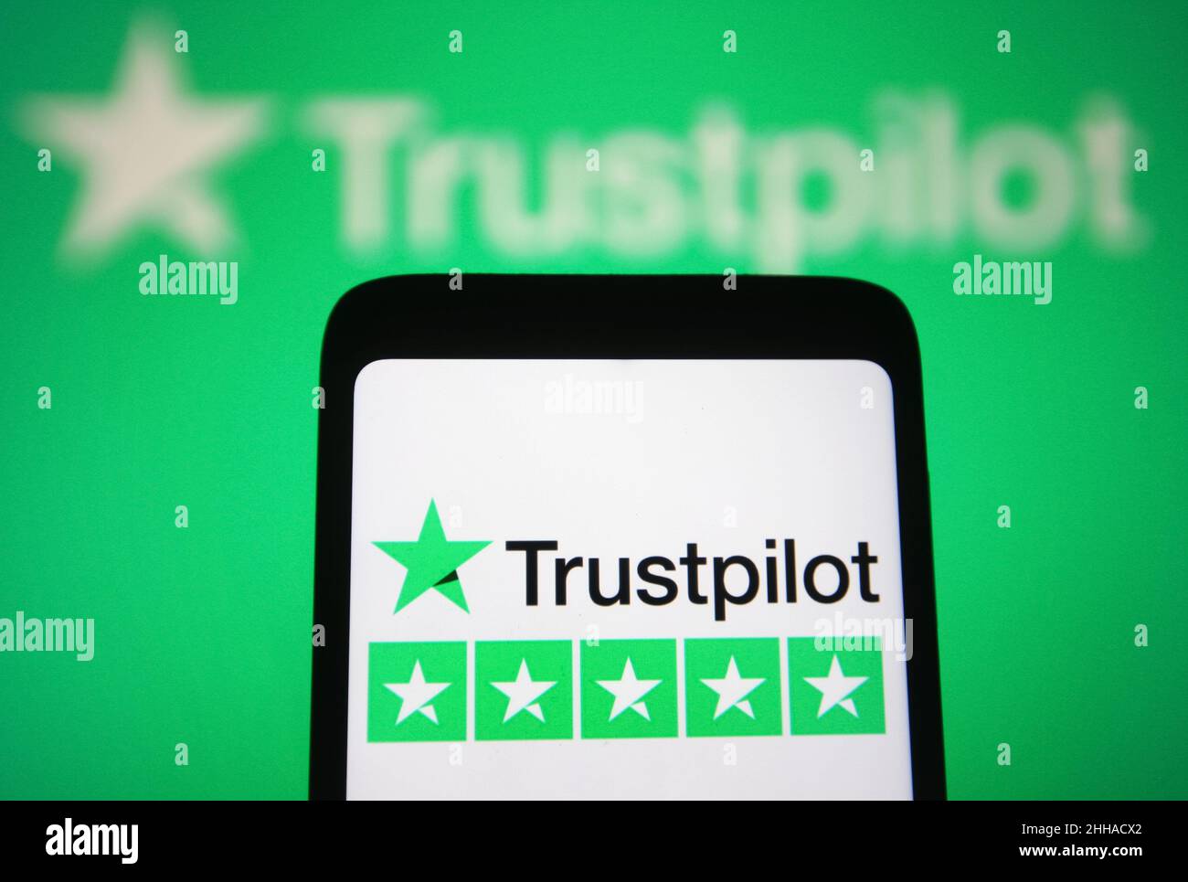 In this photo illustration, a Trustpilot (Trustpilot.com) logo is seen ...