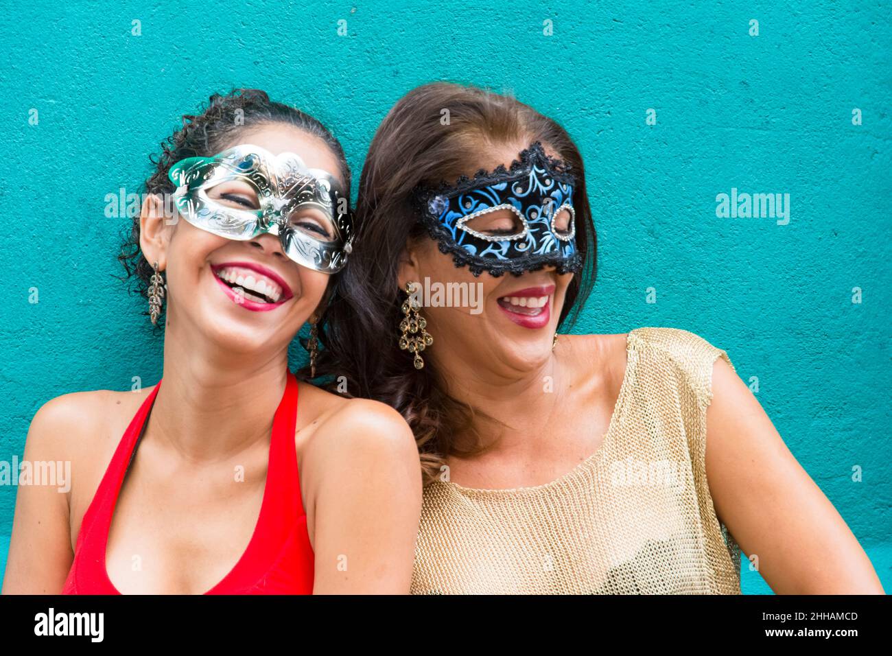Portrait of two women wearing Venice Carnival mask. Salvador, Bahia ...