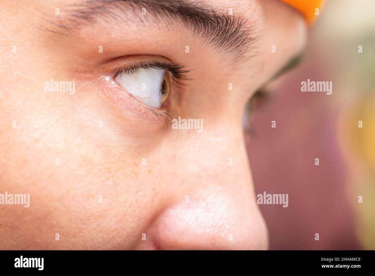 Look man side view eyes close-up indoor Stock Photo - Alamy