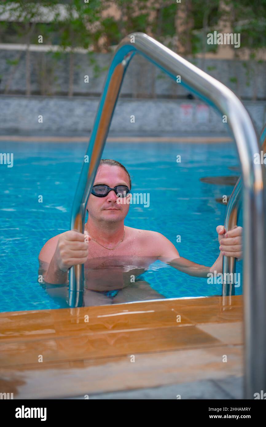 one swimmer comes out of the big pool Stock Photo - Alamy