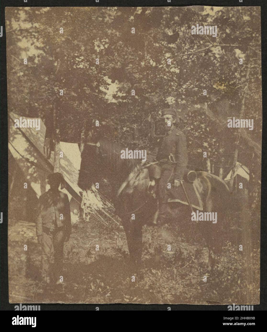 Soldier on horseback with African American servant Stock Photo - Alamy
