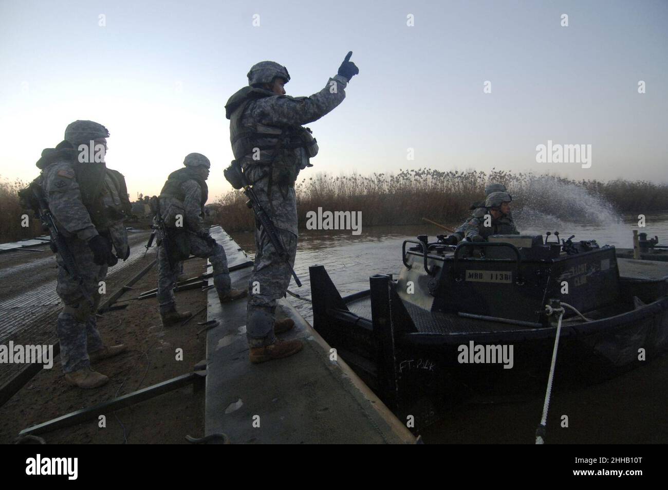 Soldiers build an assault, float bridge outside Camp Taji Stock Photo ...