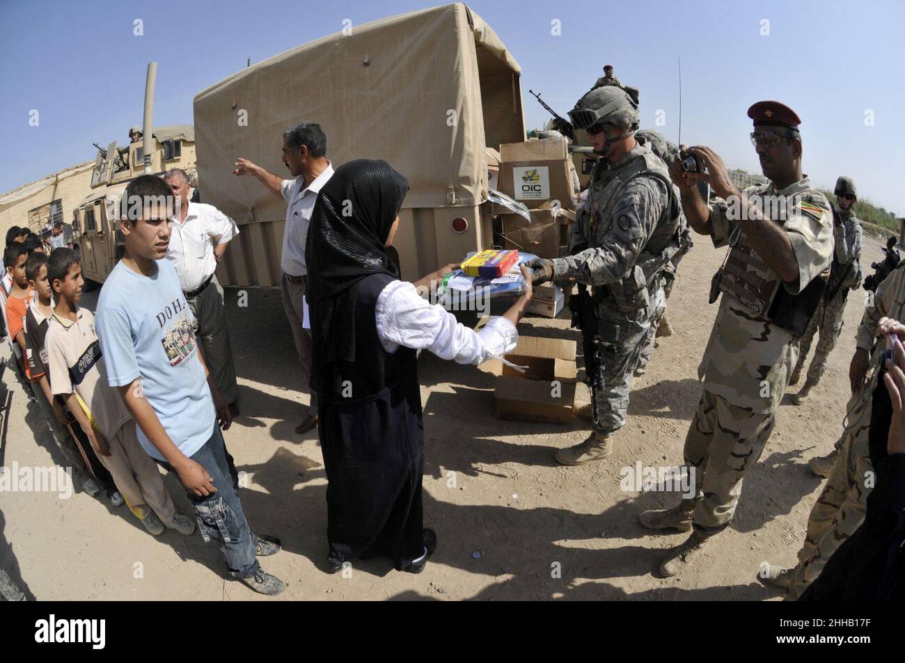 Soldiers deliver school supplies Stock Photo - Alamy