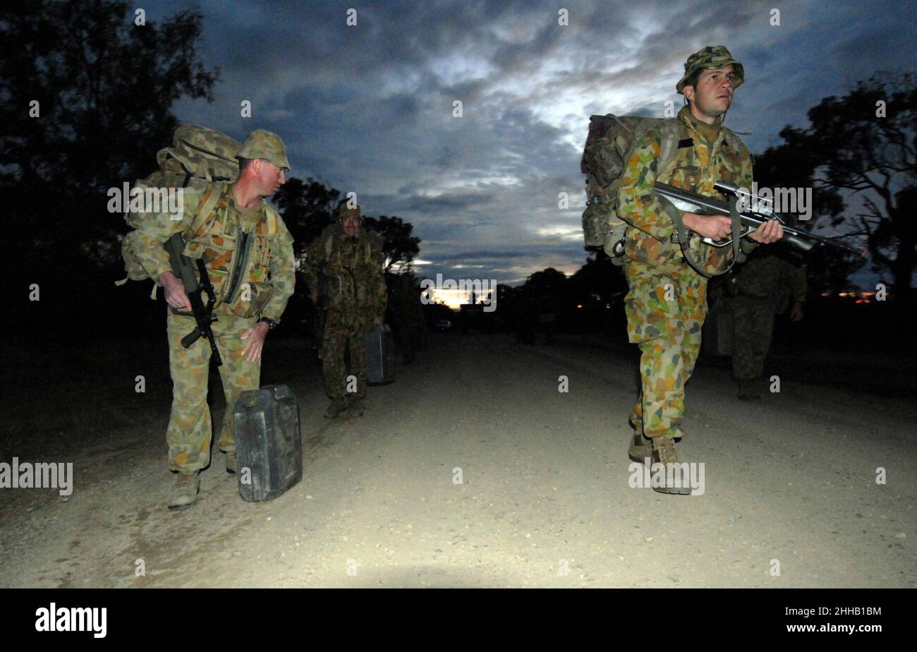 Soldiers from 2-14th Queensland Mounted Infantry scout a road prior to ...