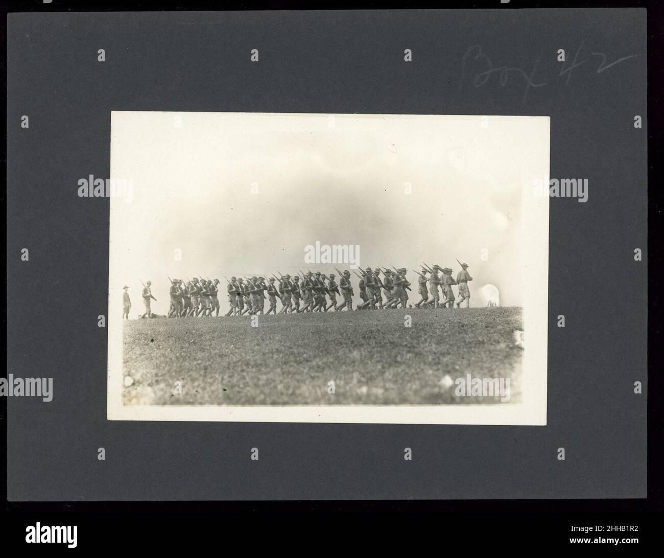 Soldiers marching with rifles in a field, probably a U.S. Army training ...