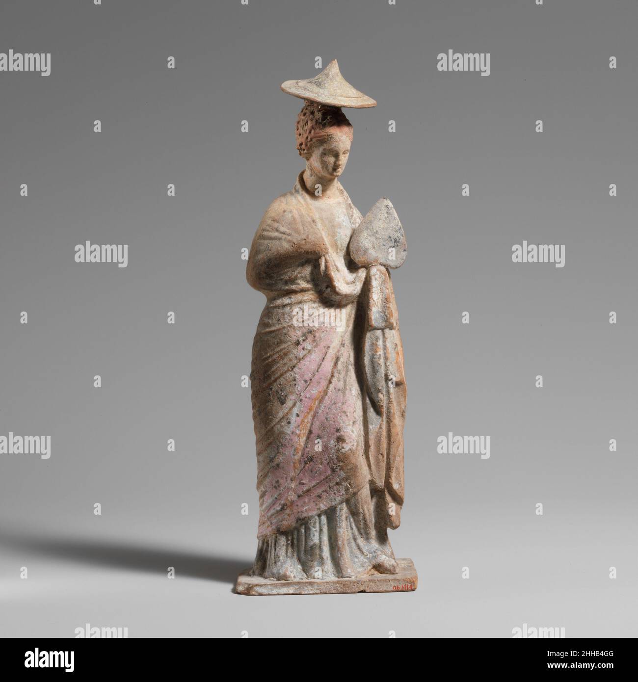 Terracotta statuette of a draped, standing woman 3rd century B.C. Greek ...