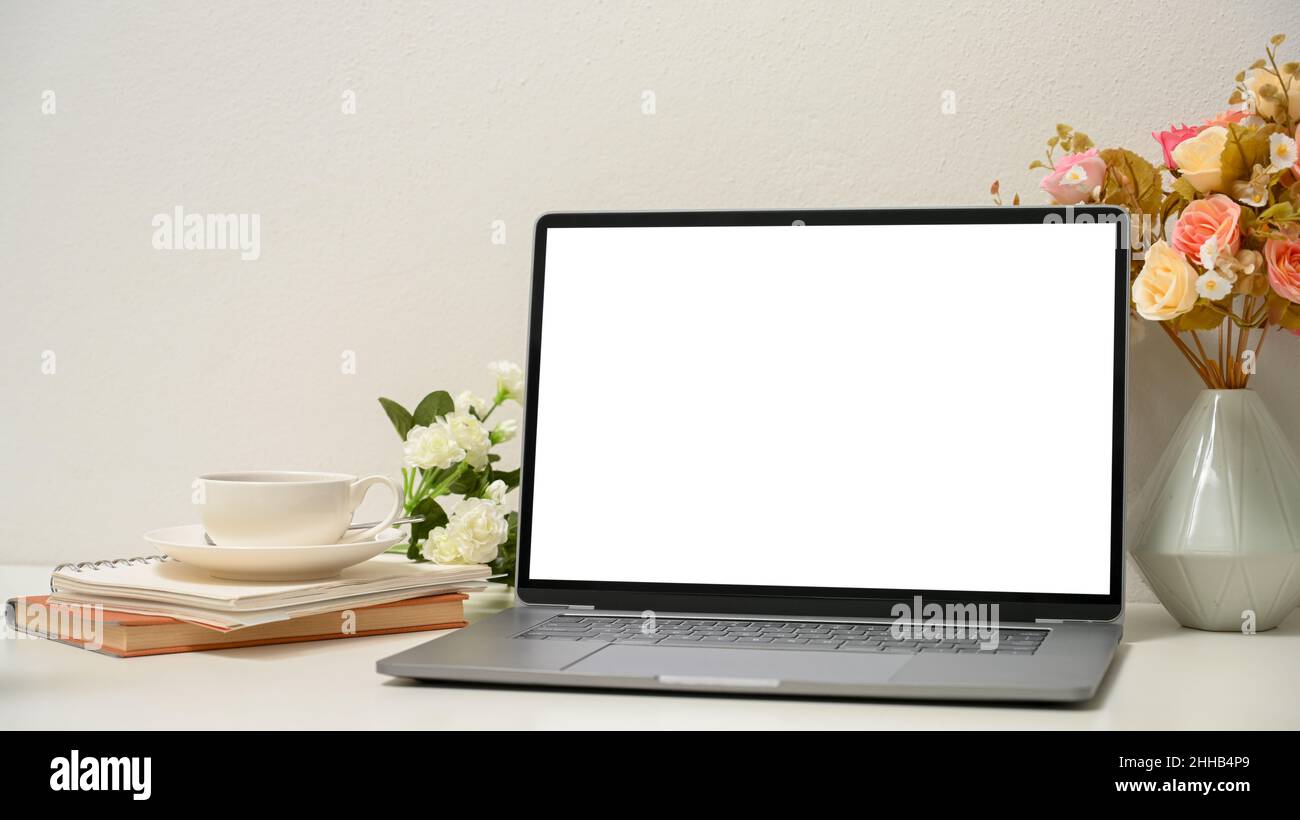 Close-up, a women's office desk with modern laptop computer white ...