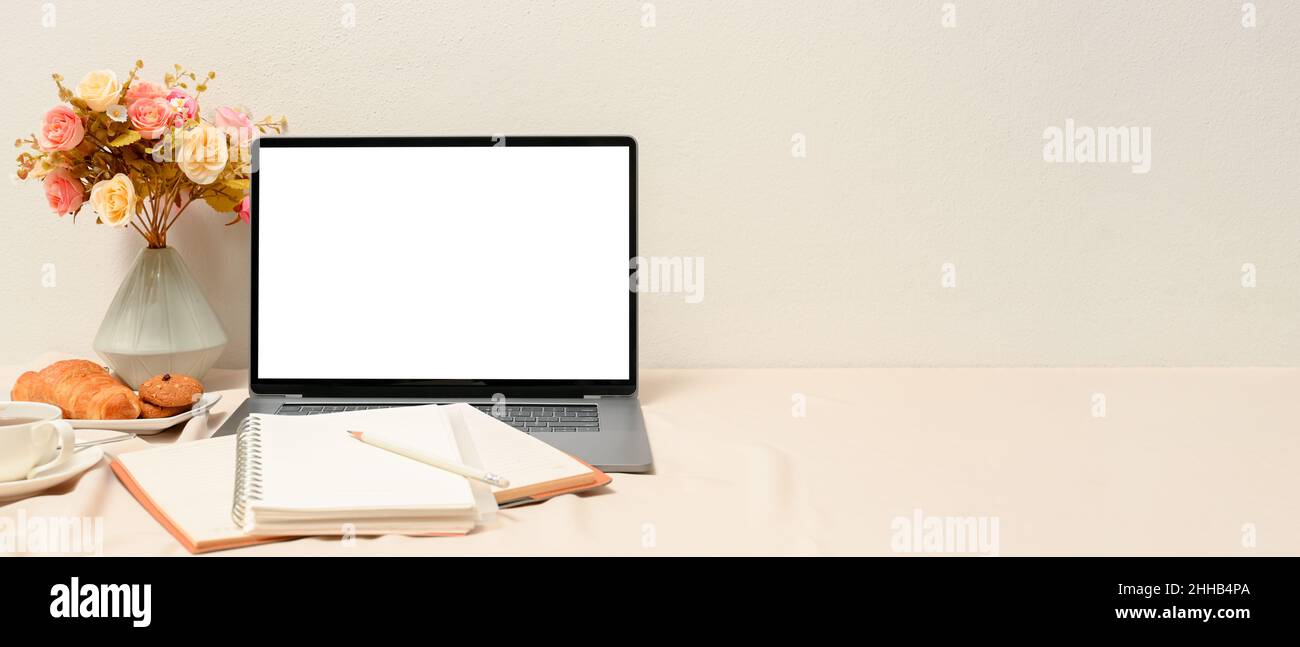 Stylish feminine workspace with laptop computer mockup, notebooks ...