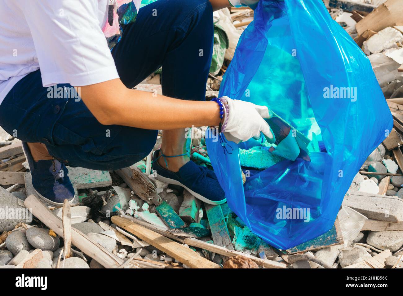 Young Woman made garbage inside a bag Stock Photo - Alamy