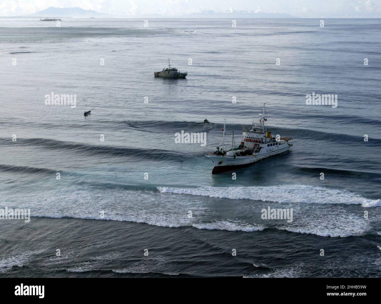 Solomon Island Police's patrol boat Lata rescuing fishing vessel Stock ...
