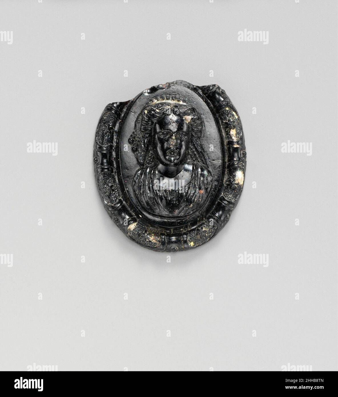 Glass medallion with the bust of a woman or goddess 1st century A.D ...