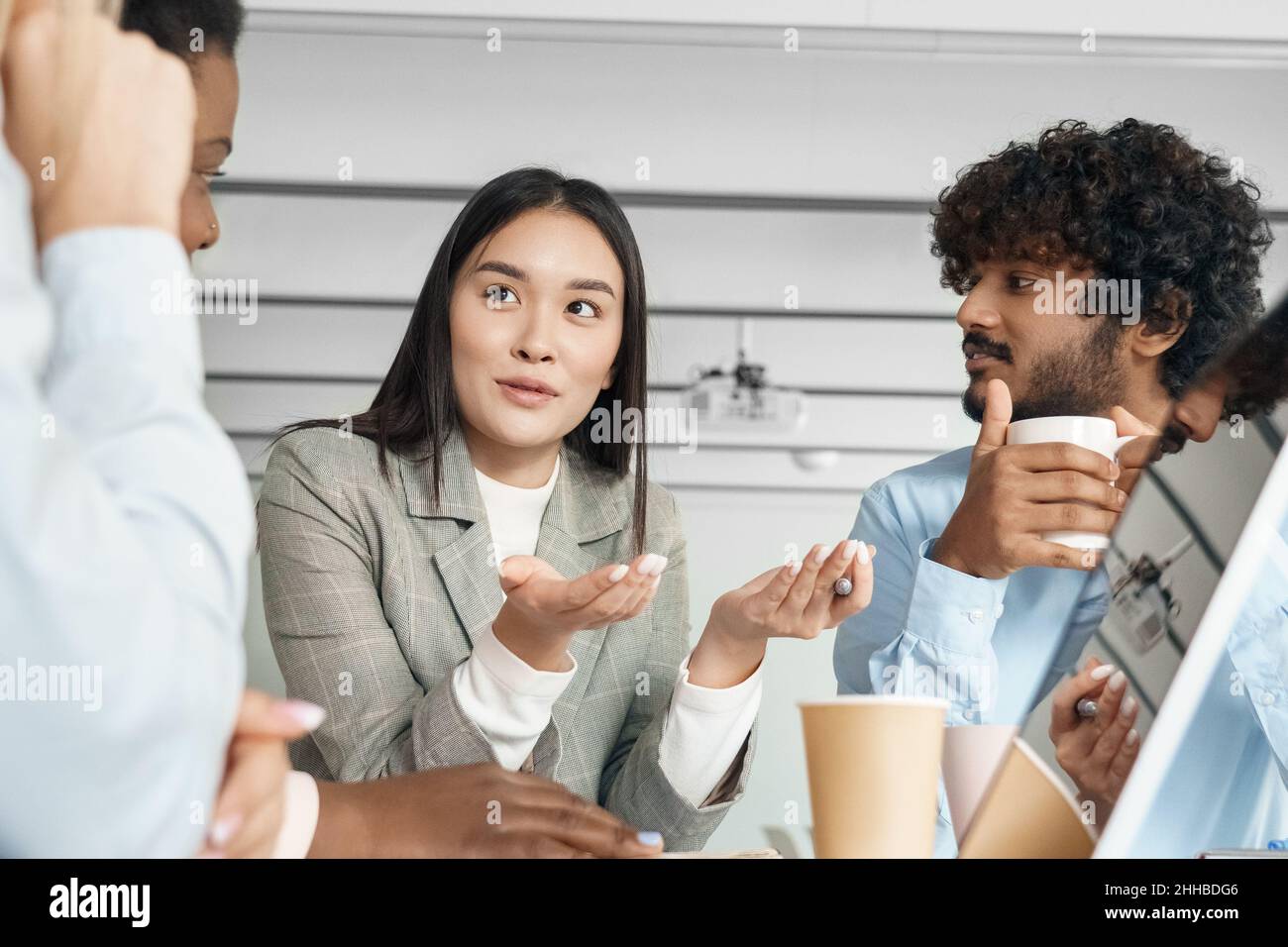 Young asian woman telling opinion speaking to multi-ethnic diverse ...