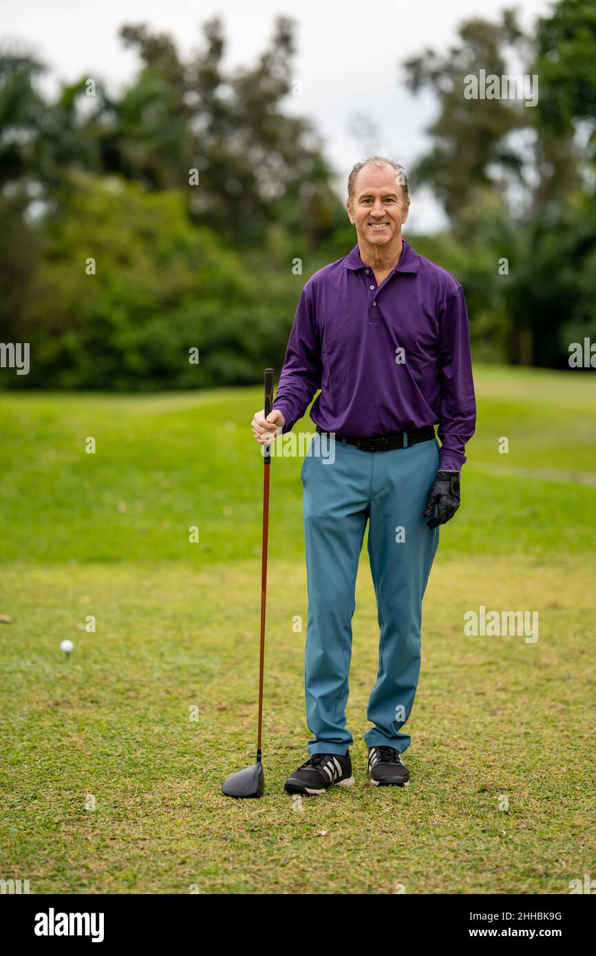 Handsome senior golfing champion on a golf course Stock Photo - Alamy