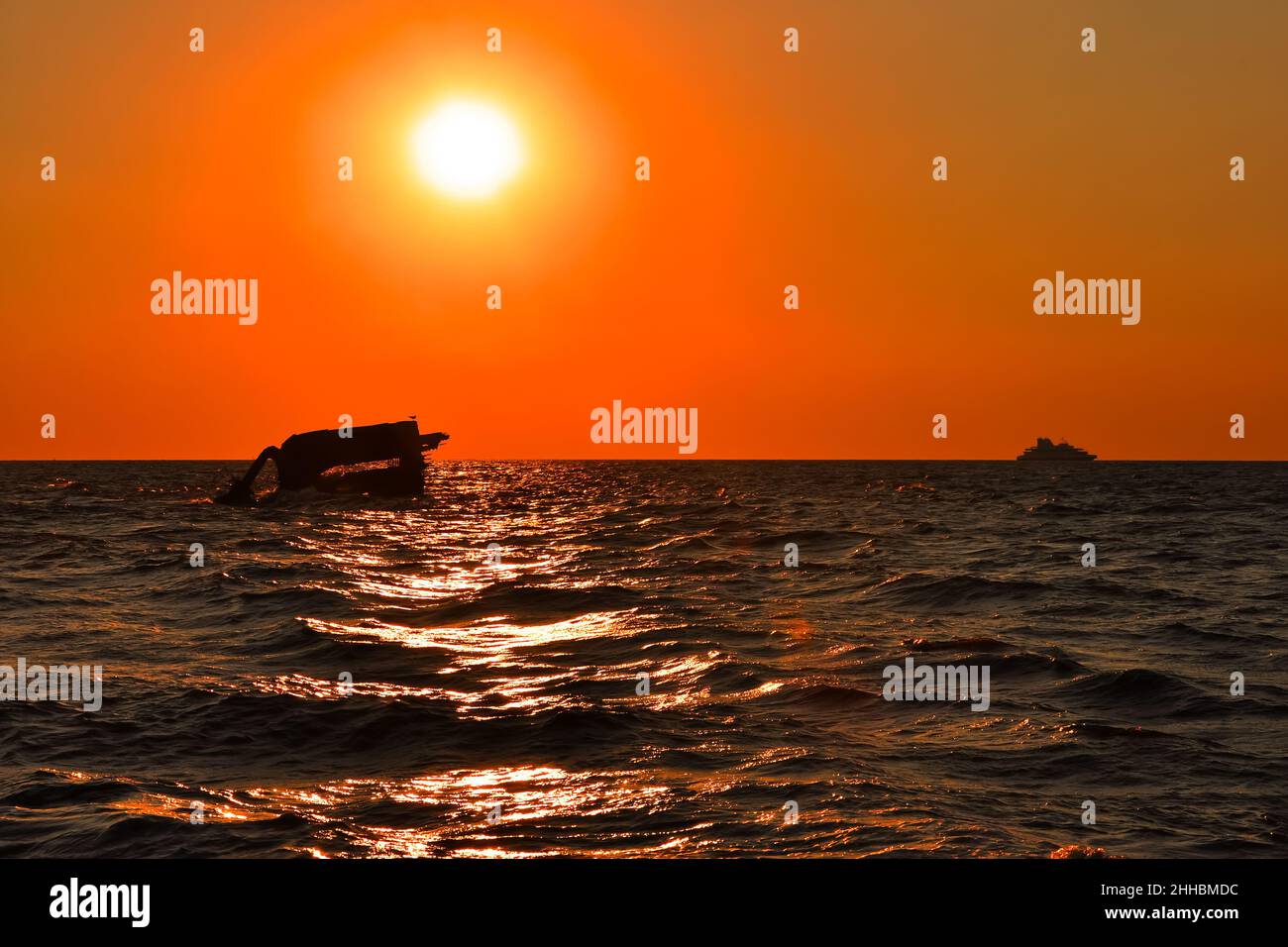 Sunset over SS Atlantus Shipwreck and Ferry in Background, Cape May ...