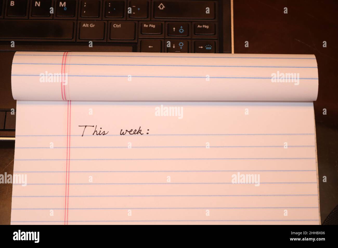 'This week', text written on notebook. Time management concept. To-do ...