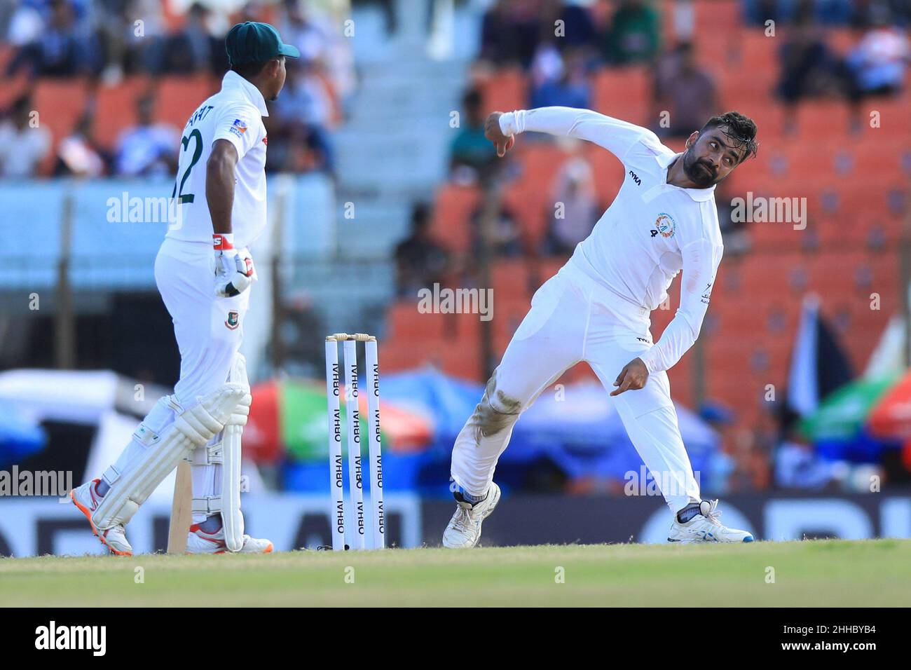 Afghanistan cricketer Rashid Khan (R) in action during one-off cricket ...